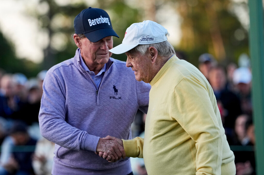 A wild hook and a big leg kick as Jack Nicklaus, Gary Player and Tom ...
